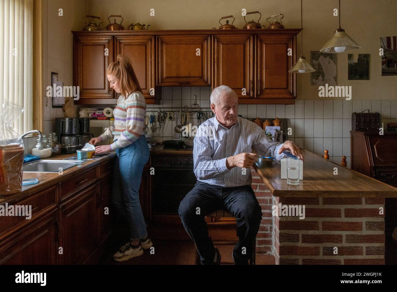 elderley man with assisted living woman organising breakfast Stock ...
