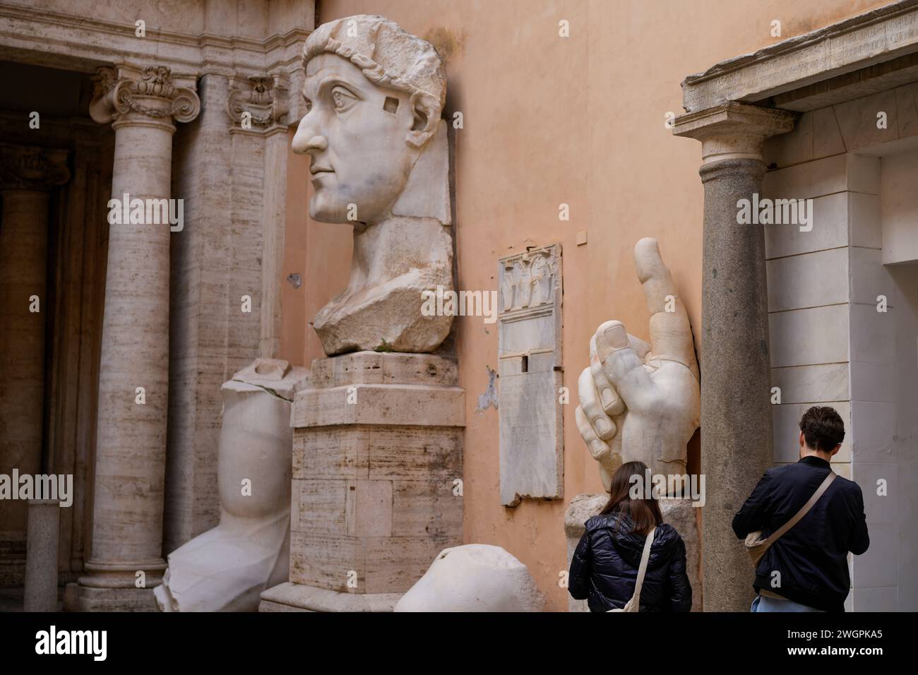 People admire the surviving portions of the statue of Roman Emperor ...