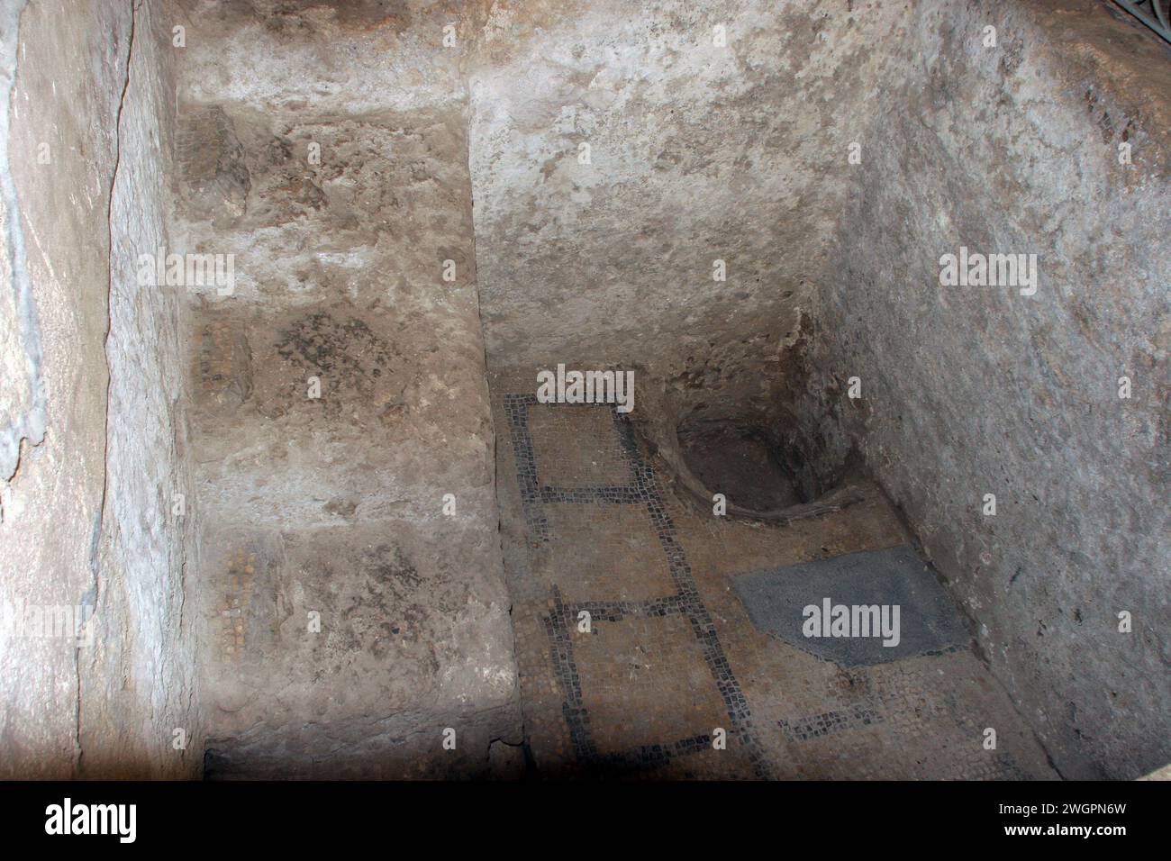 Basin feature alongside an ancient Mosaic in the basement of The Church ...