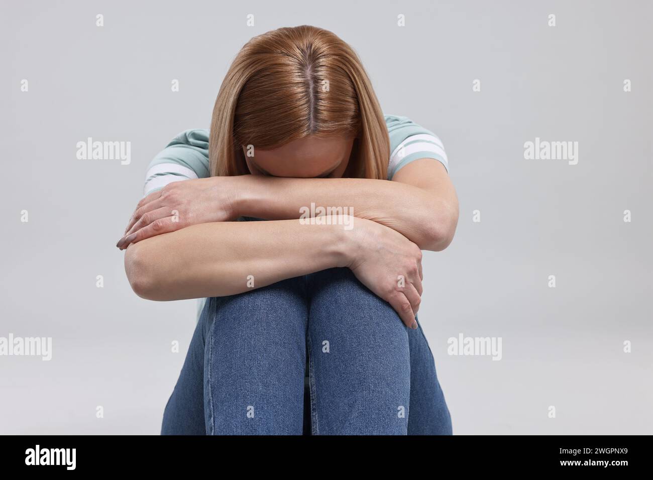 Woman hiding face sad hi-res stock photography and images - Alamy