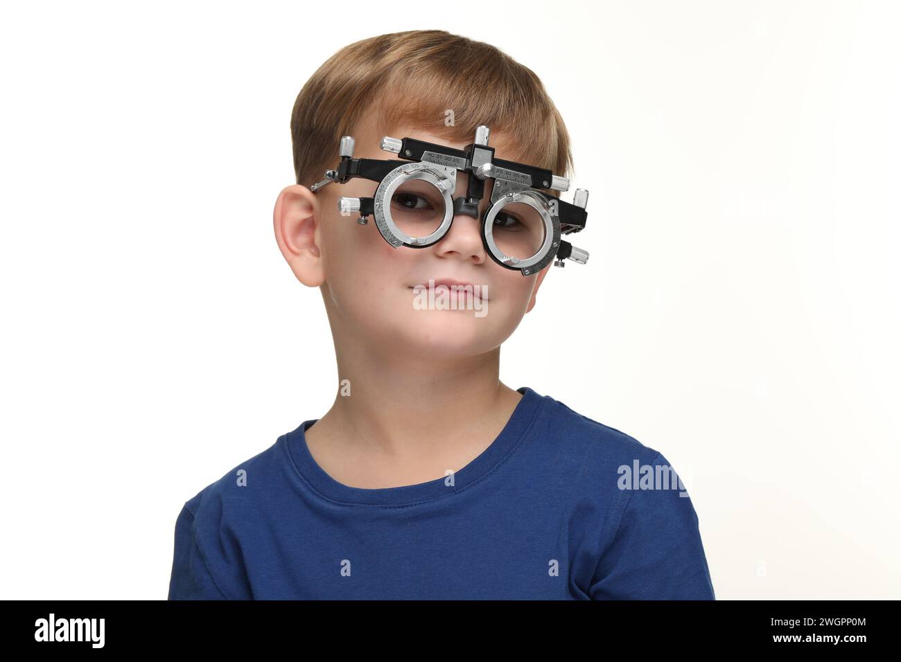 Vision testing. Little boy with trial frame on white background Stock ...