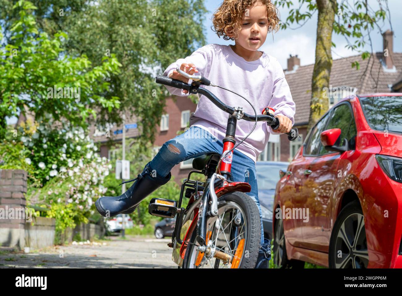 Child falling off bike hi-res stock photography and images - Alamy