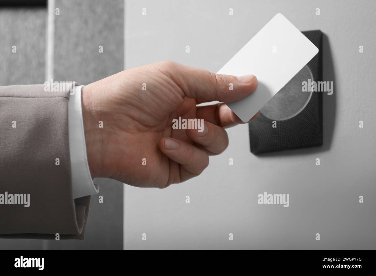 Man opening magnetic door lock with key card, closeup. Home security ...