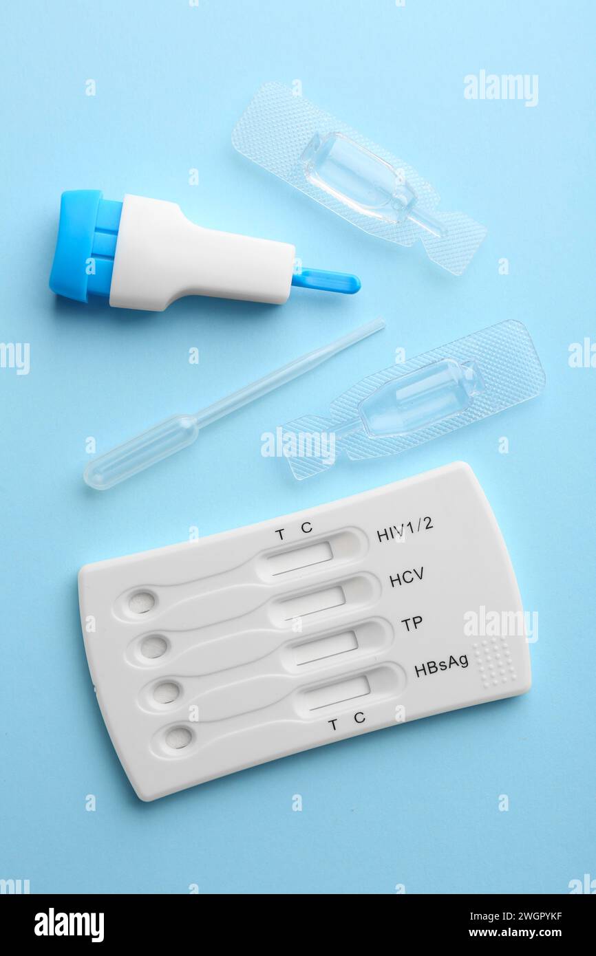 Disposable multi-infection express test kit on light blue background ...