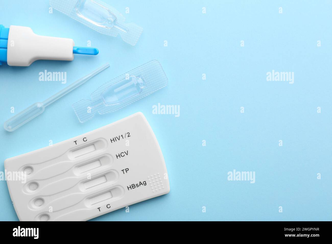 Disposable multi-infection express test kit on light blue background ...