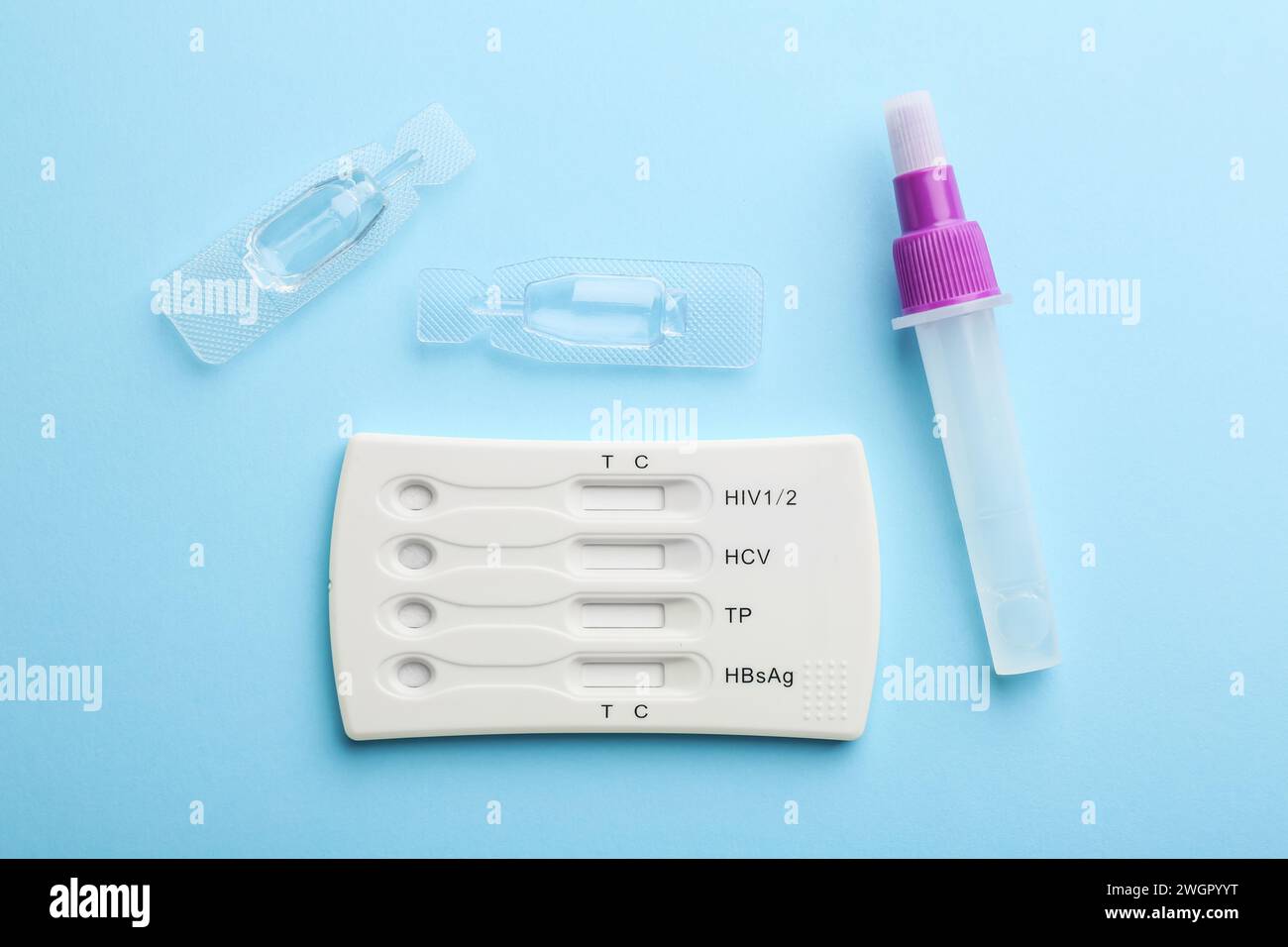 Disposable multi-infection express test kit on light blue background ...