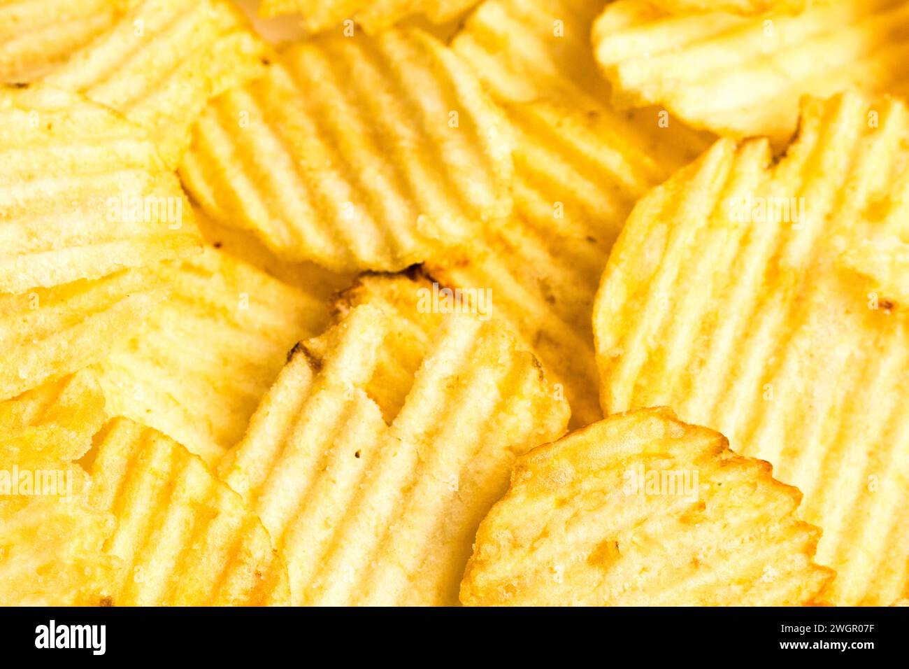 Close up of a pile of potato Chips or crisps Stock Photo - Alamy