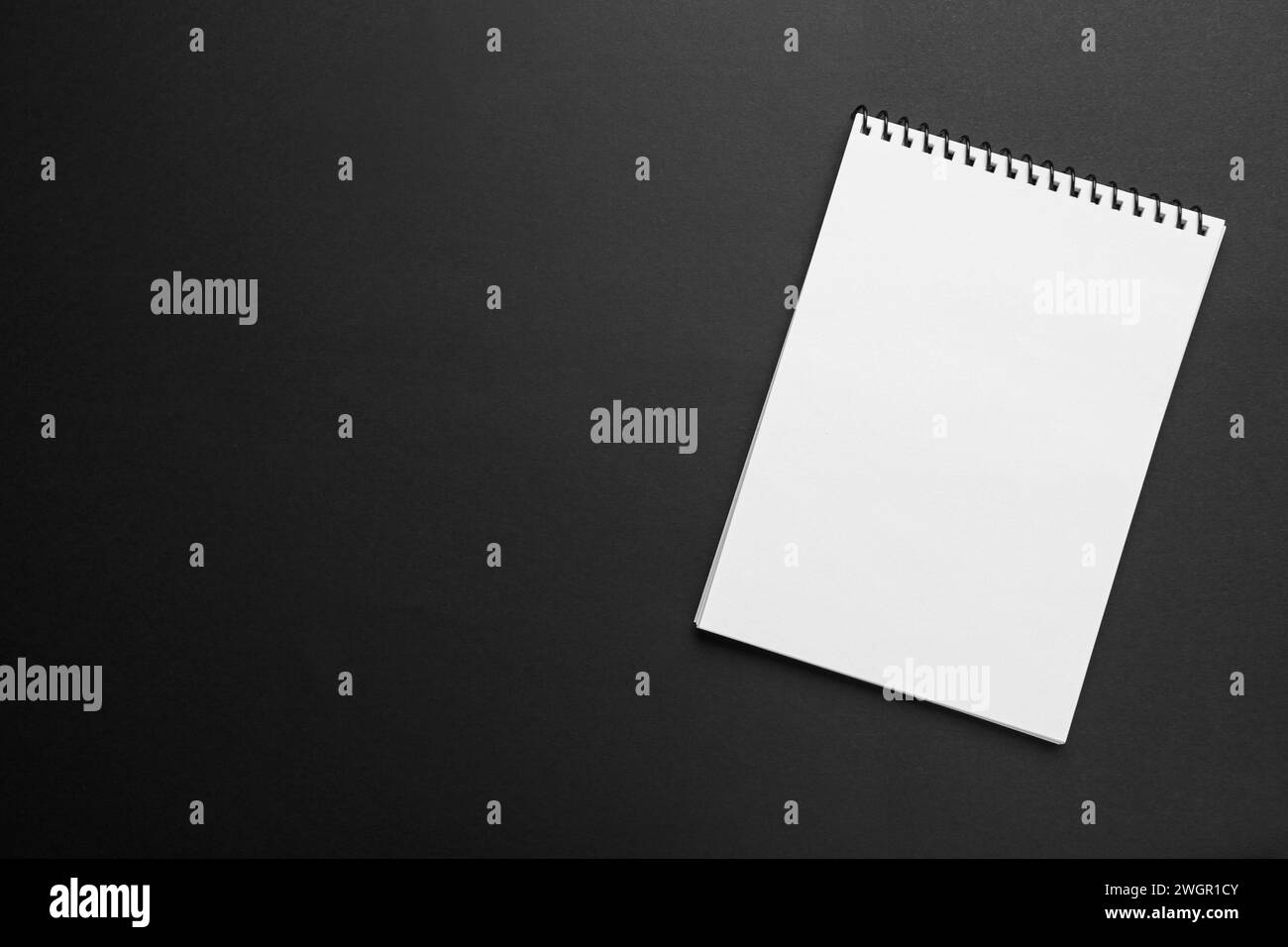 One notebook on black background, top view. Space for text Stock Photo ...