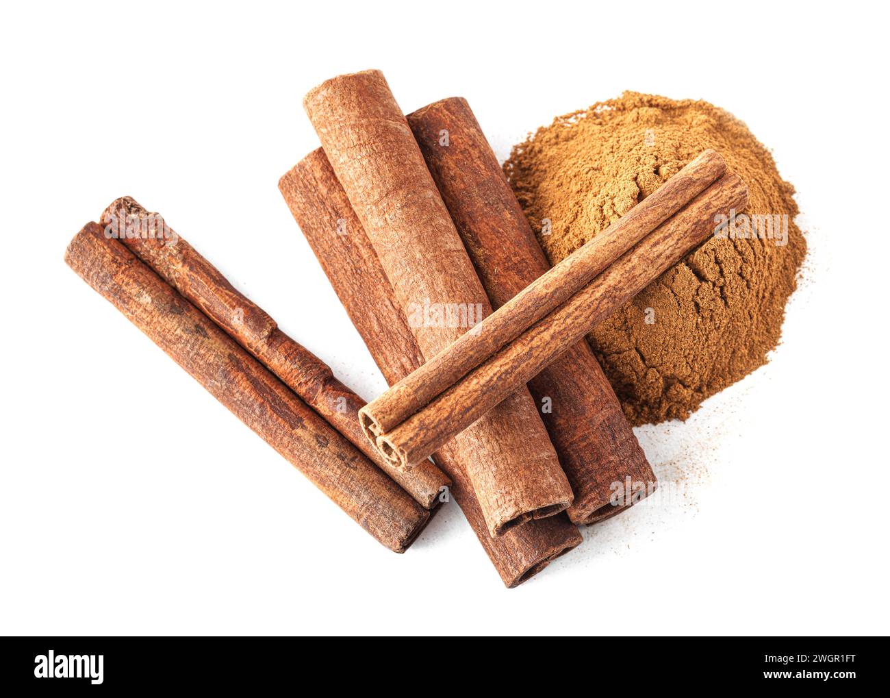 Dry aromatic cinnamon sticks and powder isolated on white, top view ...