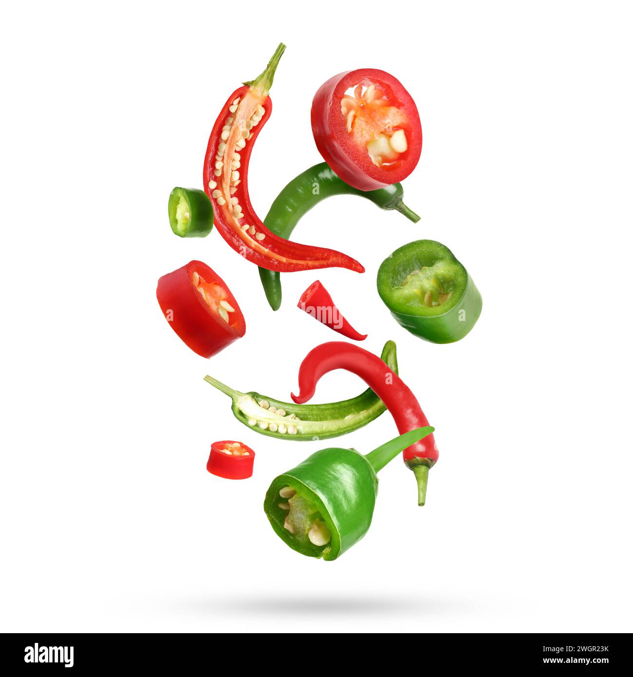 Different aromatic spices falling on white background Stock Photo - Alamy