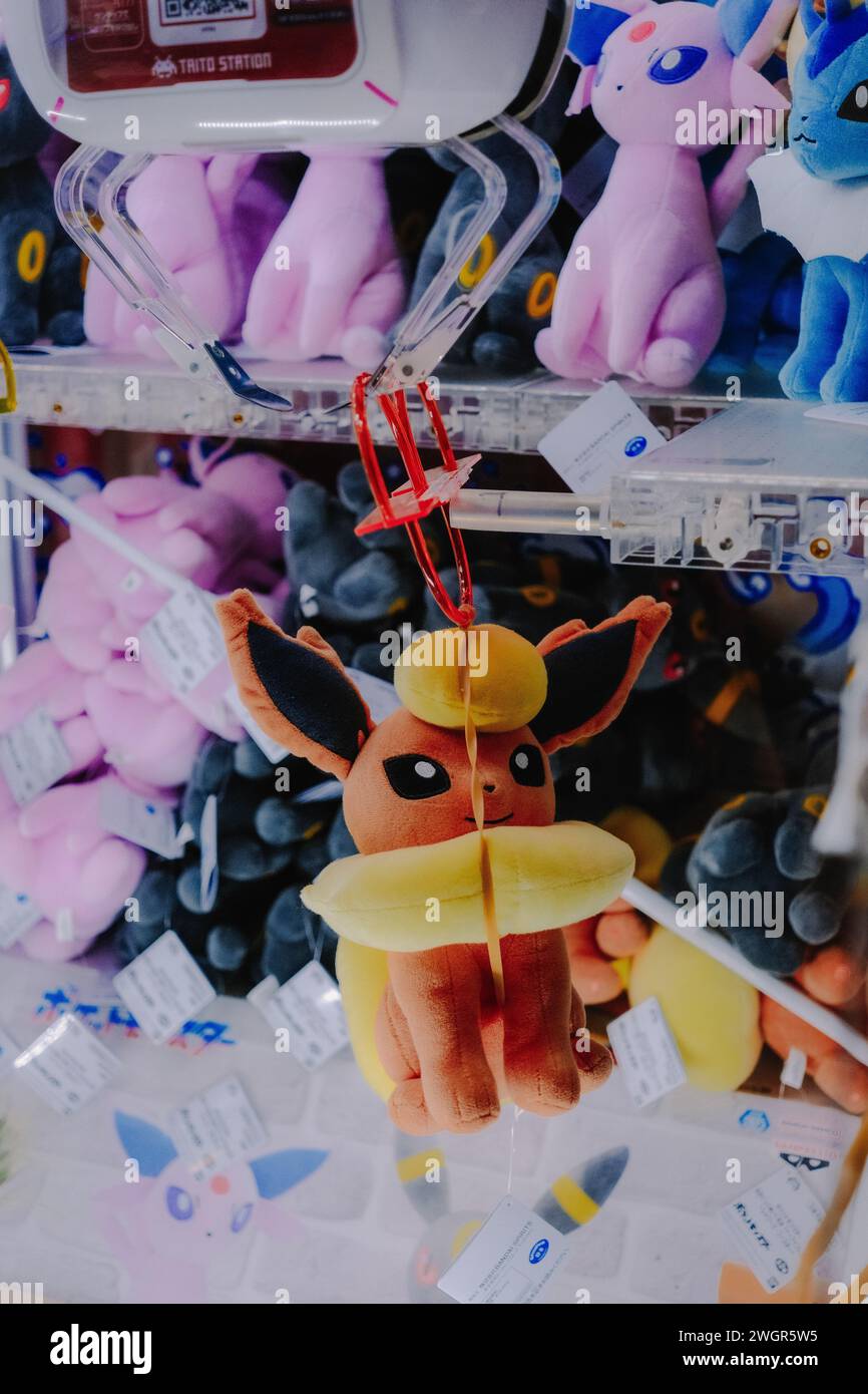 Pokemon Eevee character in claw machine, Tokyo, Japan Stock Photo - Alamy