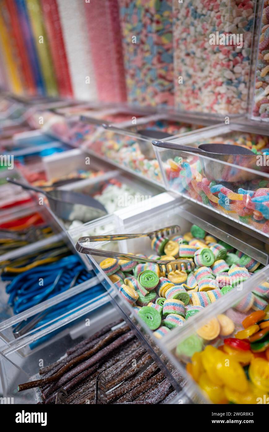 showcase of candy shop, transparent container with various sweets ...