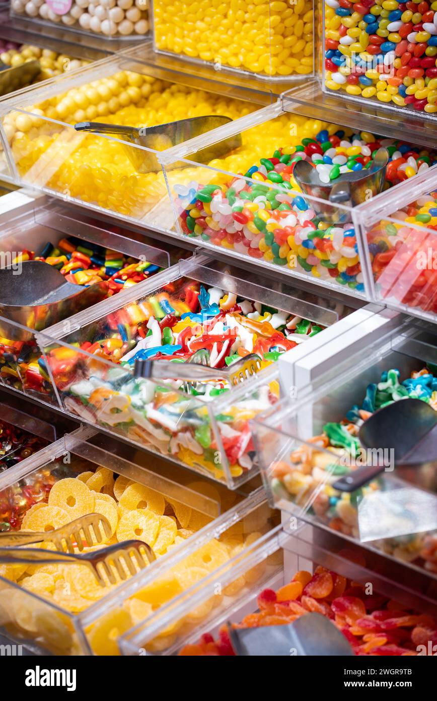 showcase of candy shop, transparent container with various sweets ...