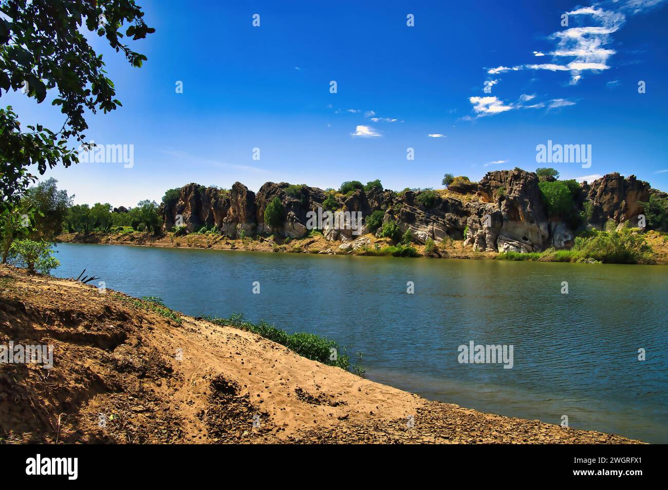 The Fitzroy River flowing through the Geikie Gorge in the rugged ...