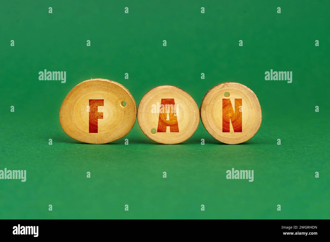 Ecological concept. On a green background, wooden roundels with the ...