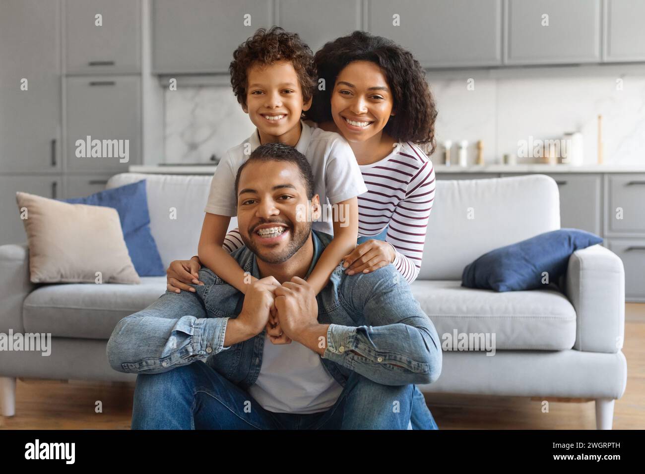 Portrait Of Happy African American Parents And Preteen Son Posing At ...