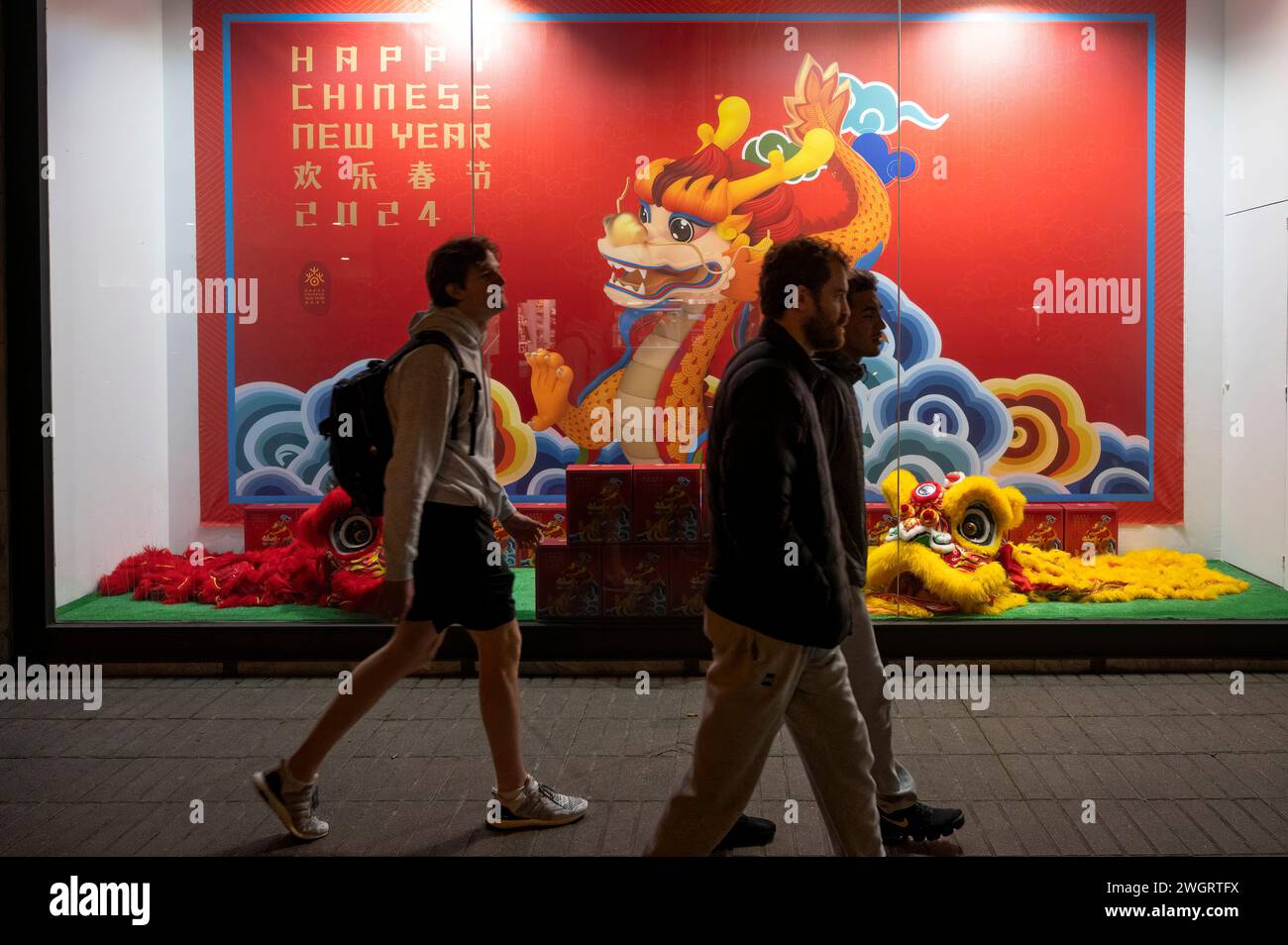 Pedestrians stroll outside the China Cultural Centre adorned with the ...