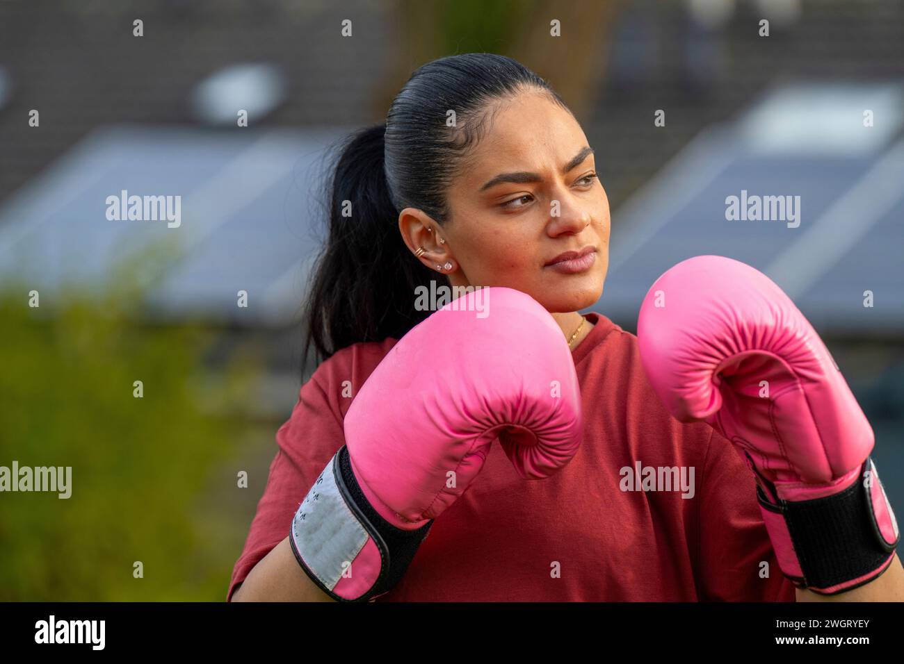 Healthy woman boxing training in a public park Stock Photo - Alamy