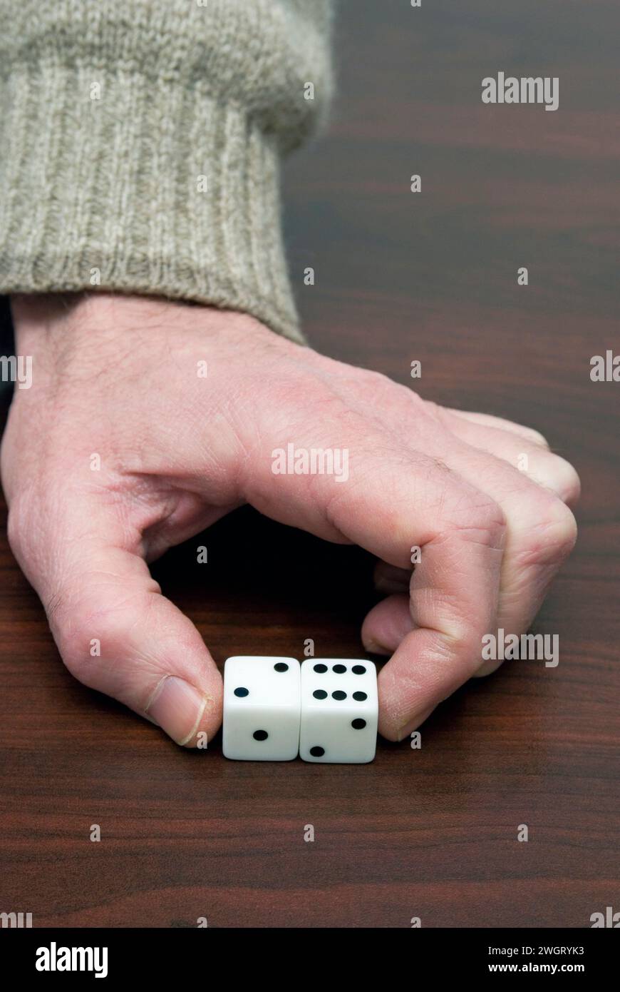 Hand holding dice hi-res stock photography and images - Alamy