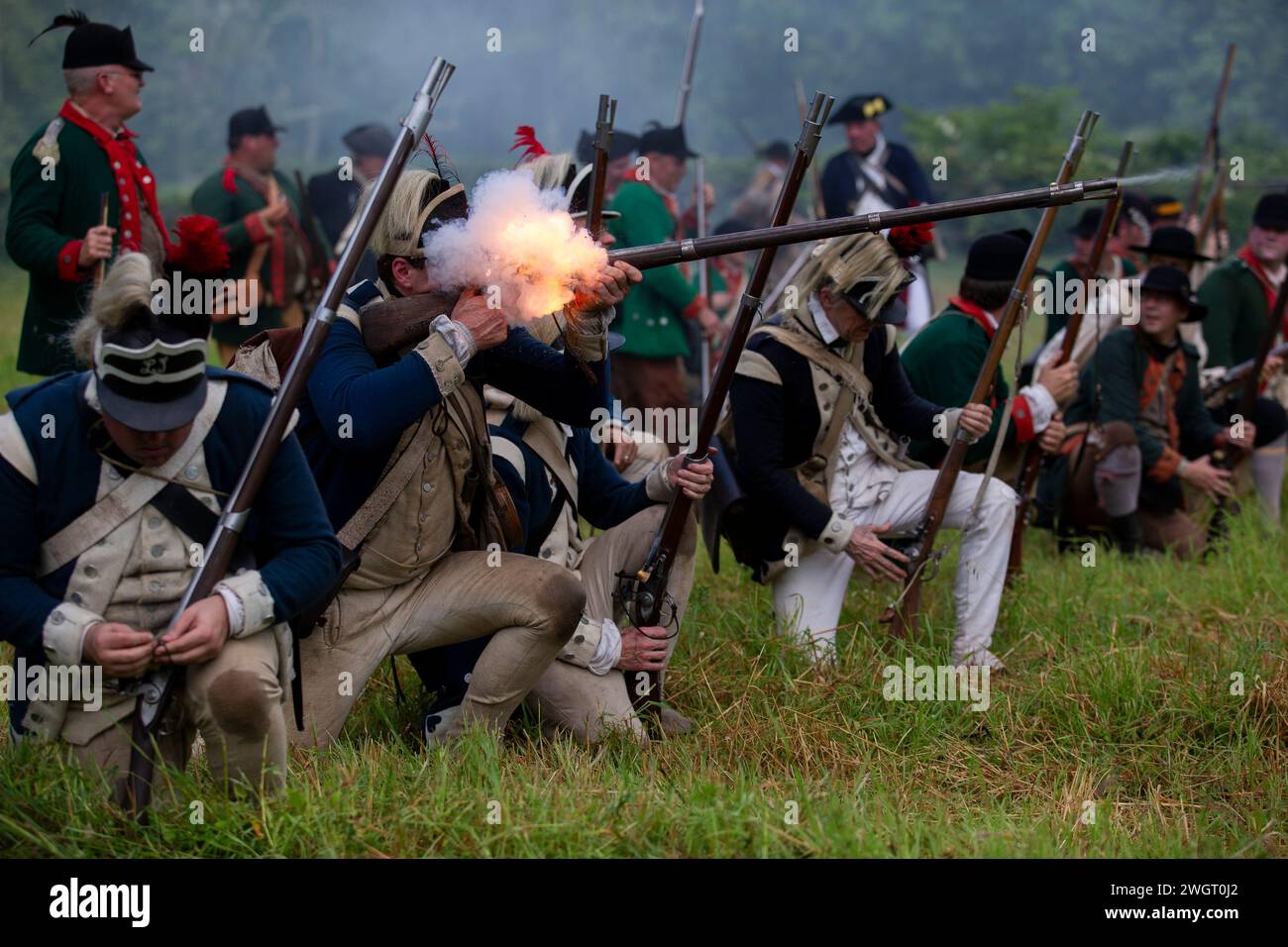 Historical re-enactors act out a revolutionary war battle between the ...