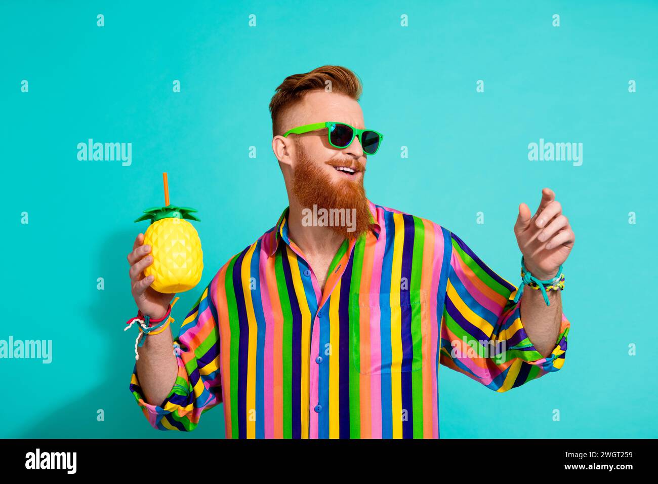 Photo of funky guy with lemonade pineapple cup with straw dancing ...