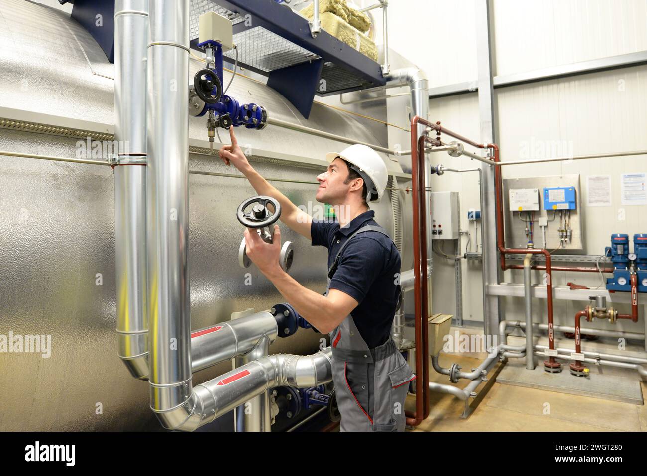 industrial worker repairs machines and equipment in a refinery Stock ...
