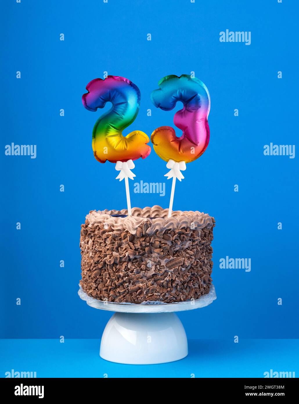 Air balloon number 23 - Birthday cake on blue background Stock Photo ...