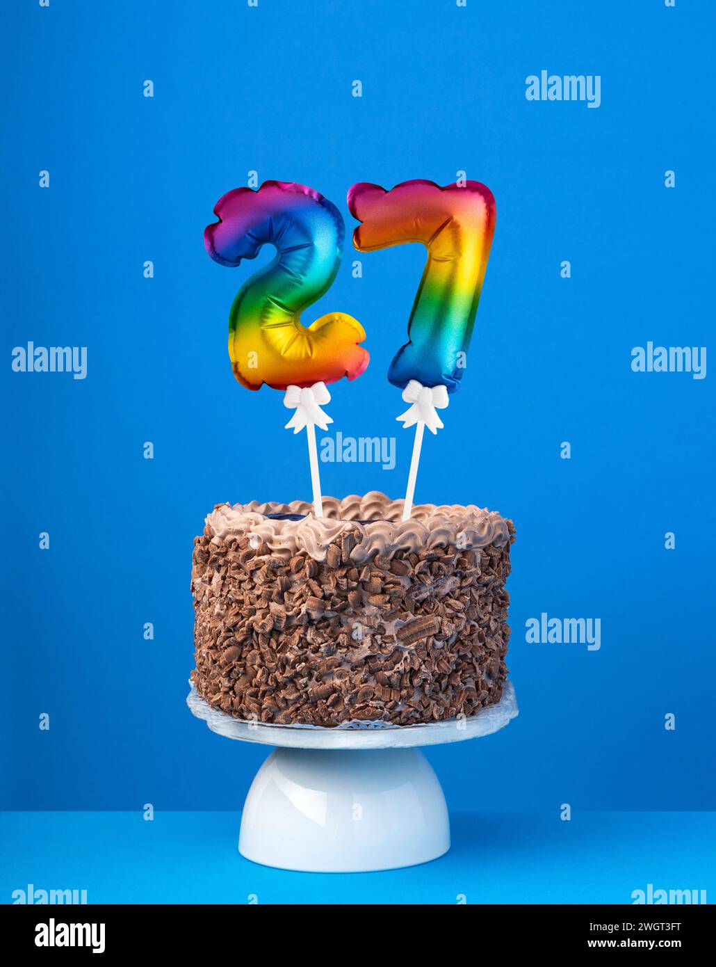 Air balloon number 27 - Birthday cake on blue background Stock Photo ...