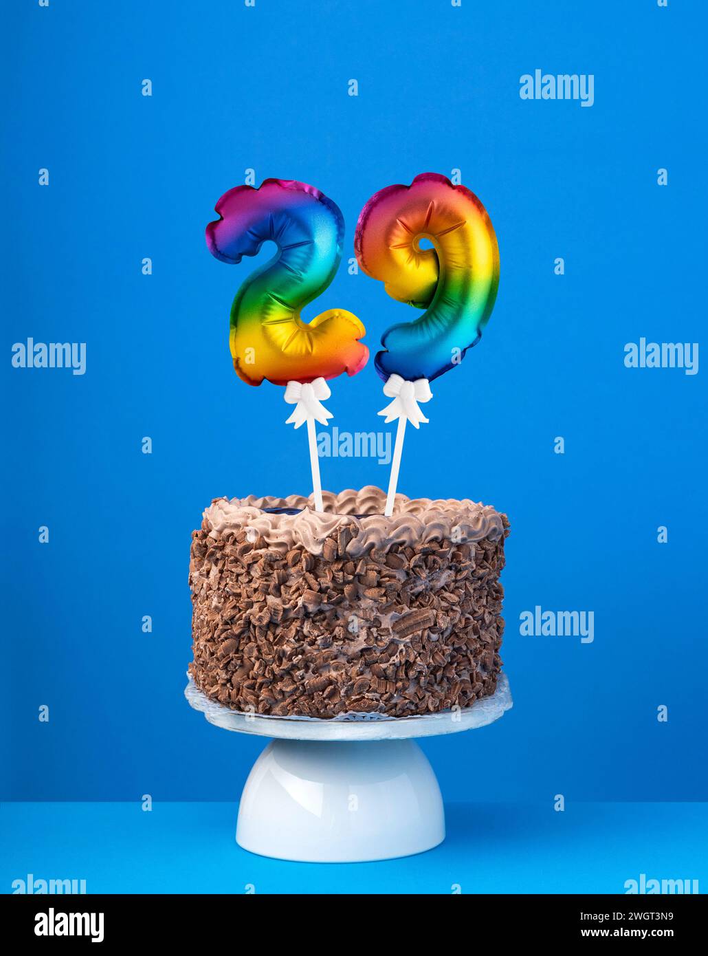 Air balloon number 29 - Birthday cake on blue background Stock Photo ...