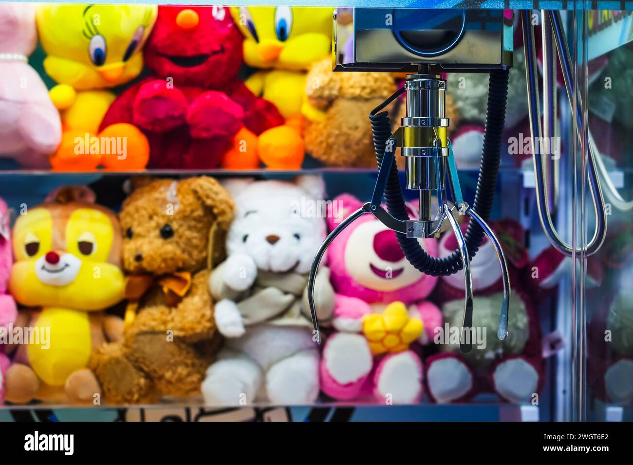 Toy crane vending machine, claw game or cabinet to catch the toys ...