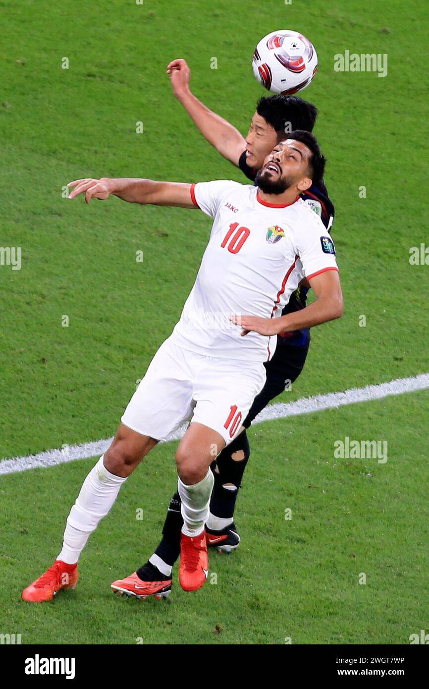 South Korea's Hwang Hee-chan, left, and Jordan's Mousa Altamari go for ...