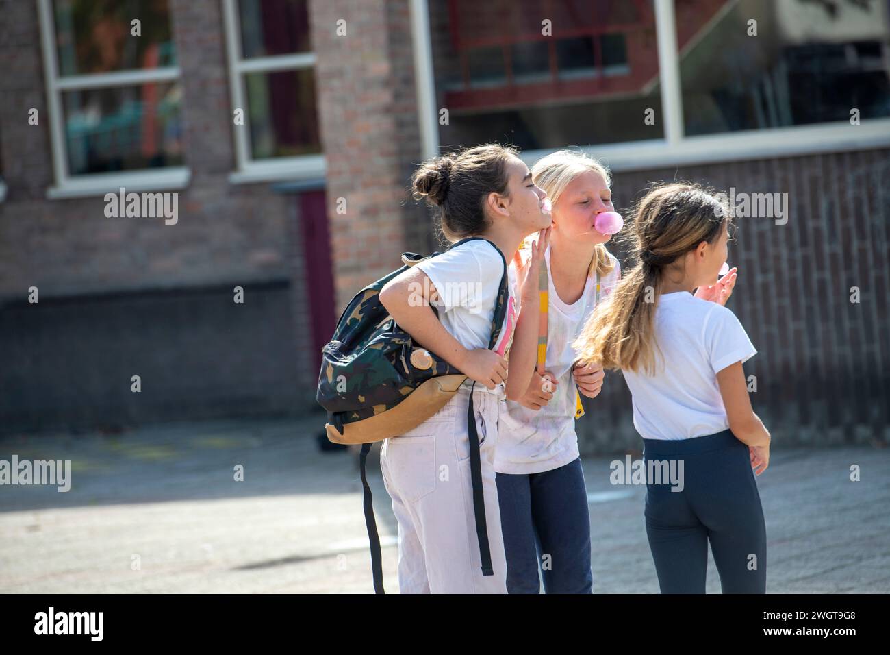 Women blowing bubble gum hi-res stock photography and images - Alamy