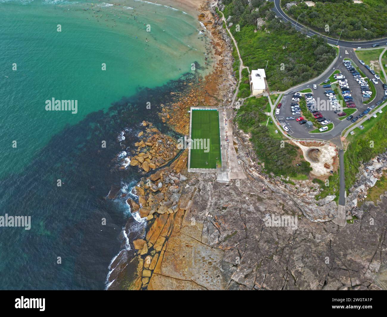 An aerial view of Freshwater Rockpool with parked cars on the green ...