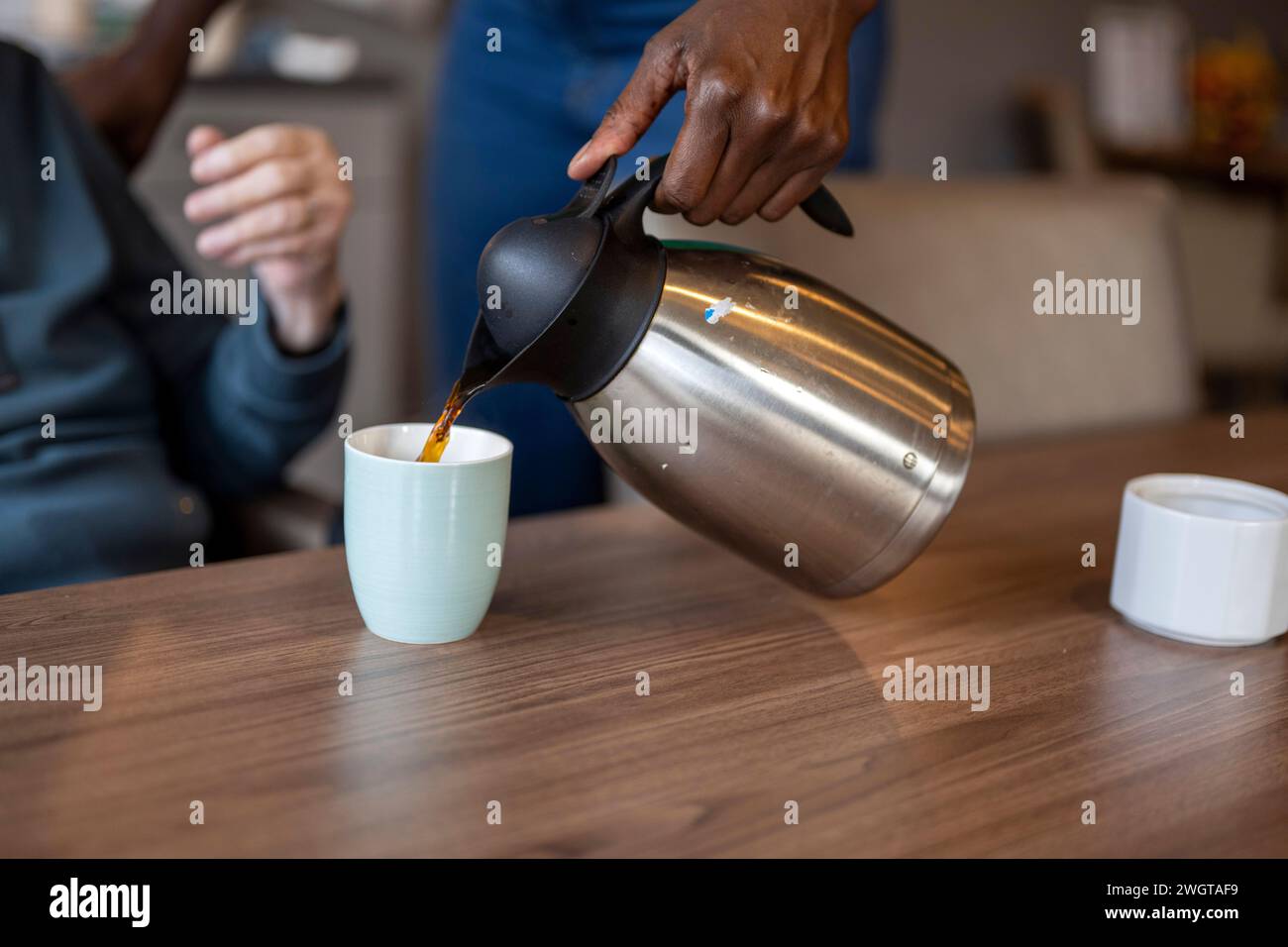 Adult caring cup hi-res stock photography and images - Alamy