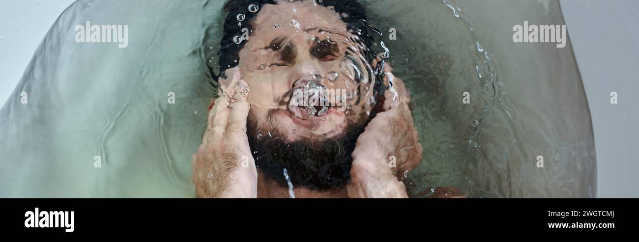 frustrated depressed man drowning in bathtub during breakdown, mental ...