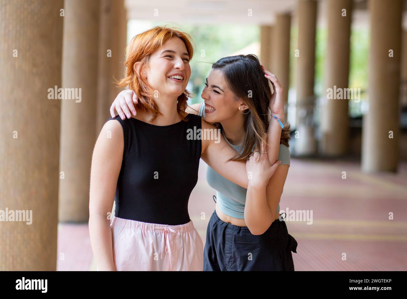 two female best friends laughing together Stock Photo - Alamy