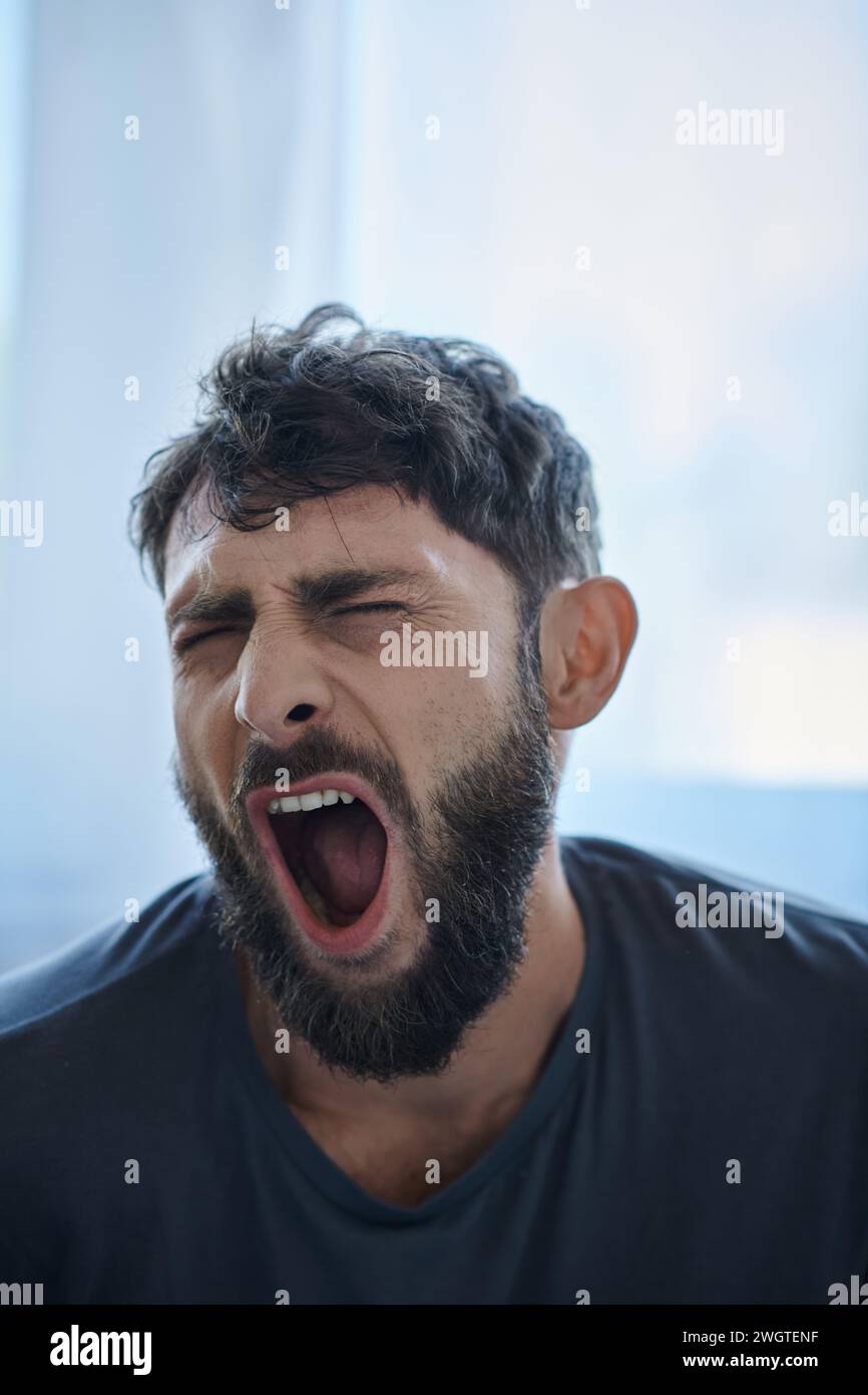 anxious man in everyday t shirt screaming during depressive episode ...