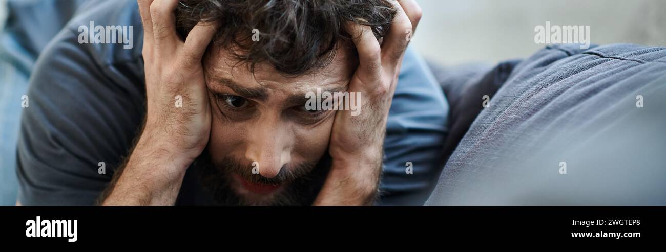 desperate man screaming with hand on his face during breakdown, mental ...