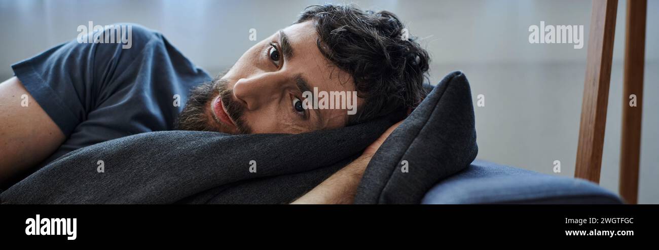 depressed man in casual outfit lying on sofa during breakdown, mental ...