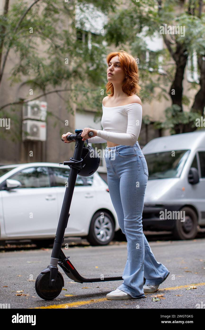 Pushing an electric scooter hi-res stock photography and images - Alamy