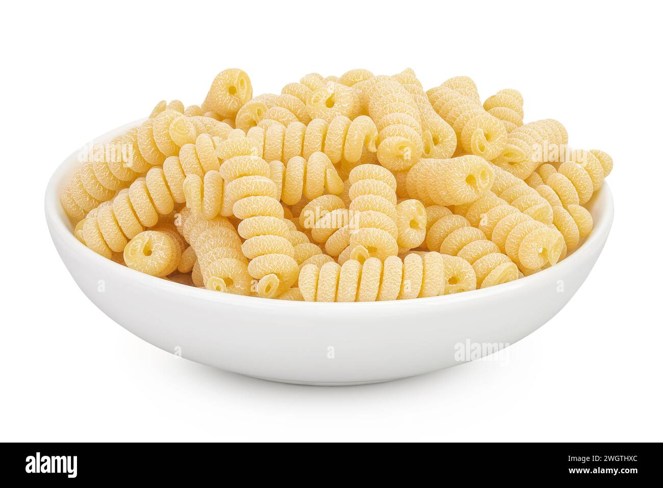 Italian spiral shaped pasta, Fusilli bucati macaroni in ceramic bowl ...