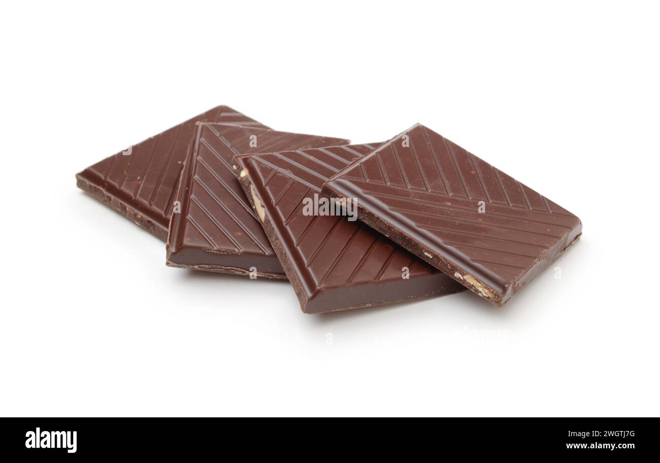 A few pieces of dark chocolate isolated on white Stock Photo - Alamy