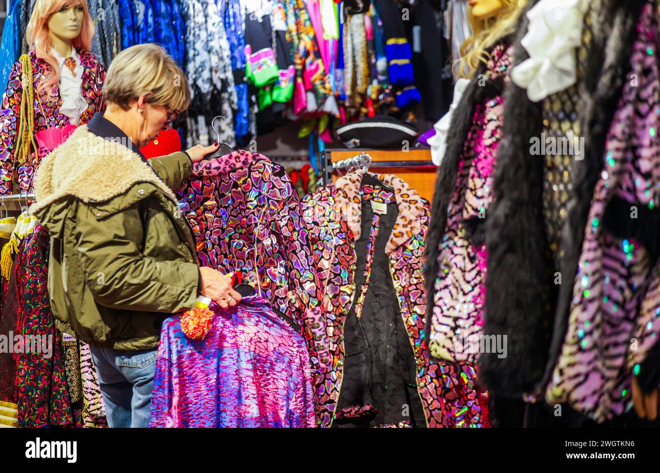 DEN BOSCH - Customers of a party store try on clothes for the carnival ...