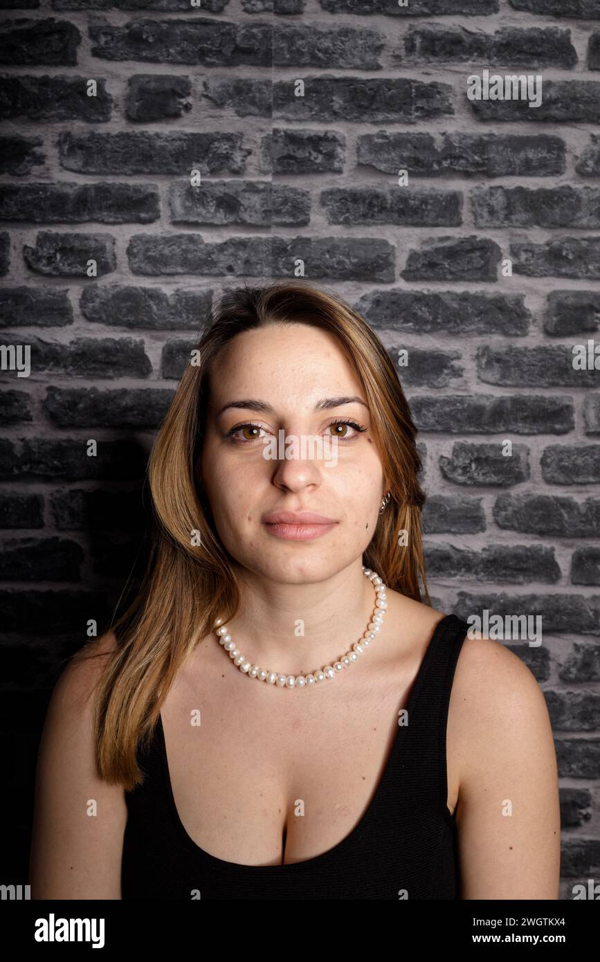 Young person standing indoors hi-res stock photography and images - Alamy