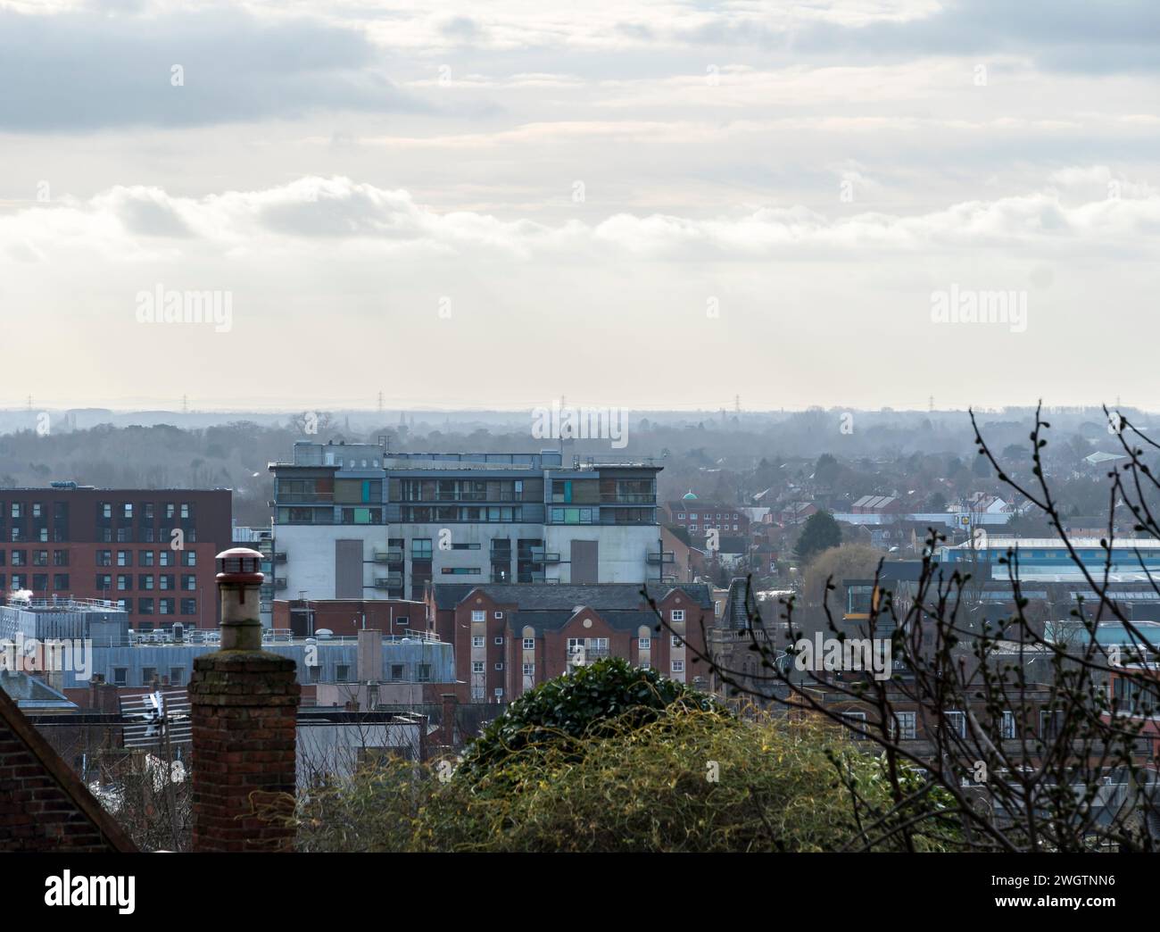View to horizon over Lincoln city rooftops on misty day in winter ...