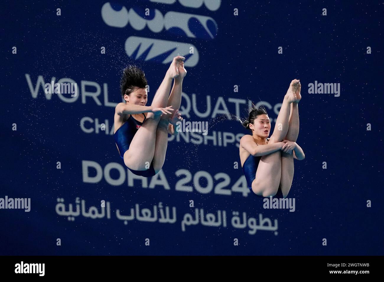 Kim Mi Rae and Jo Jin Mi of North Korea compete during the women's ...