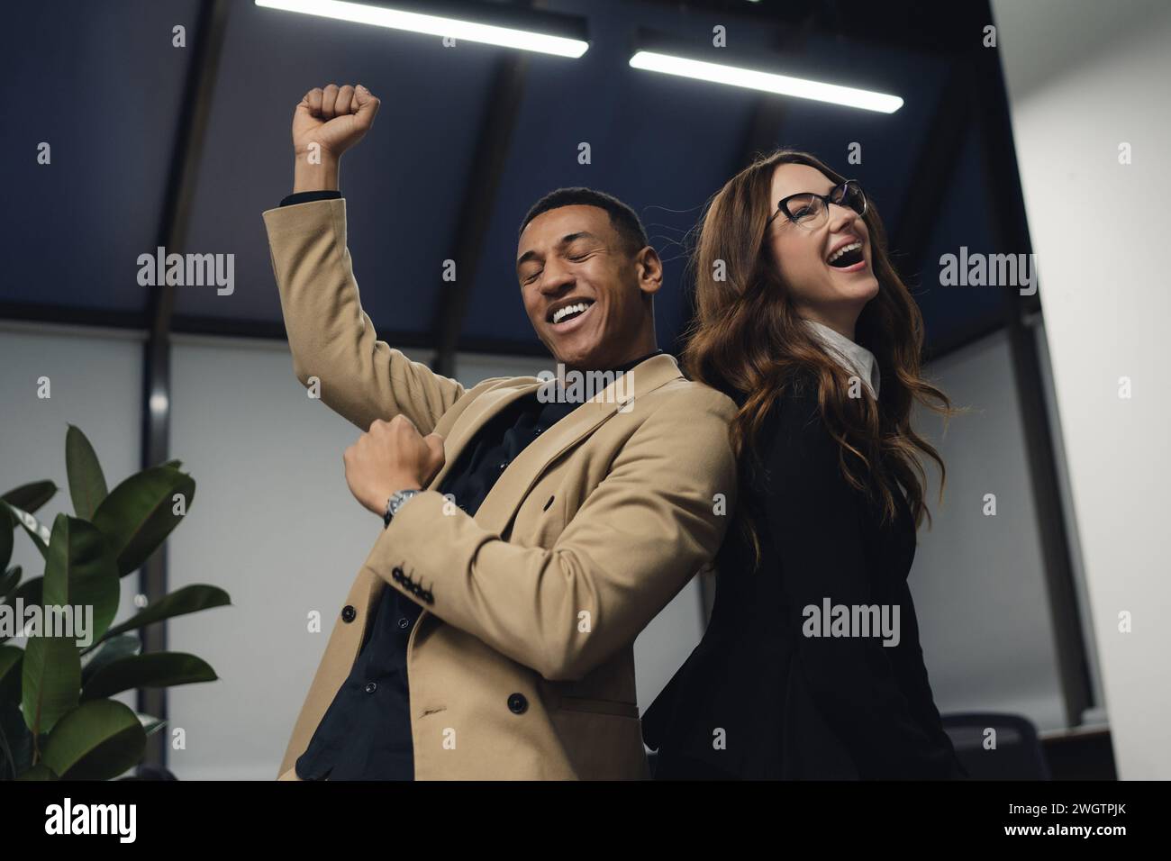 Excited diverse employees team celebrating teamwork success Stock Photo ...