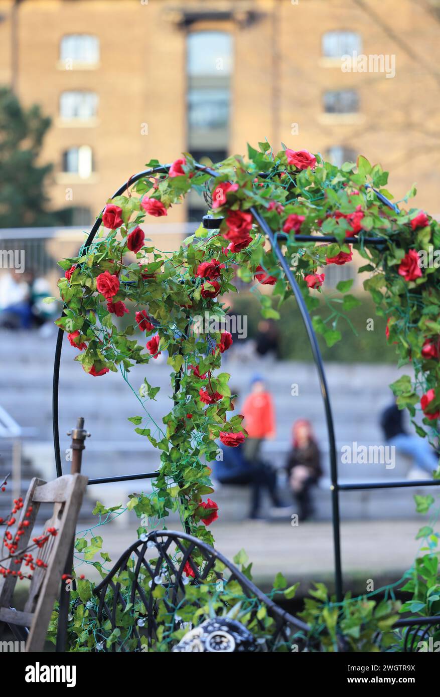 Roses on a barge on Regents Canal with Central St Martins on Granary ...