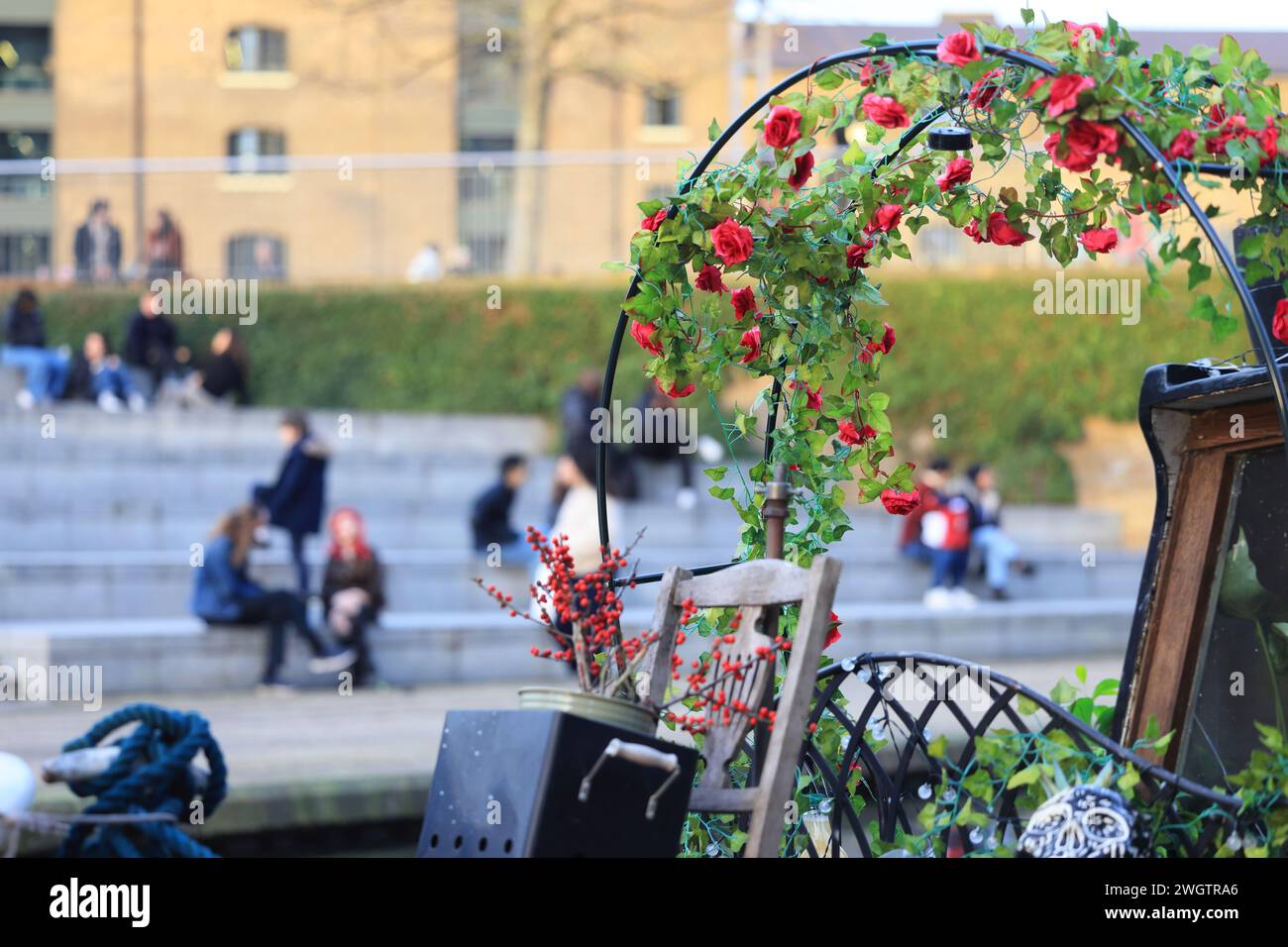 Roses on a barge on Regents Canal with Central St Martins on Granary ...