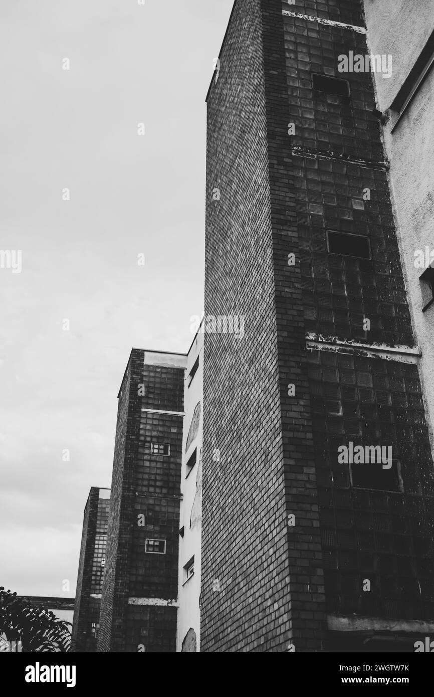 Black an white brick block building Stock Photo - Alamy